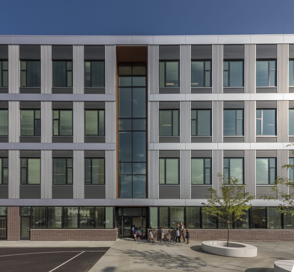 Many panels clad school - Metal Architecture