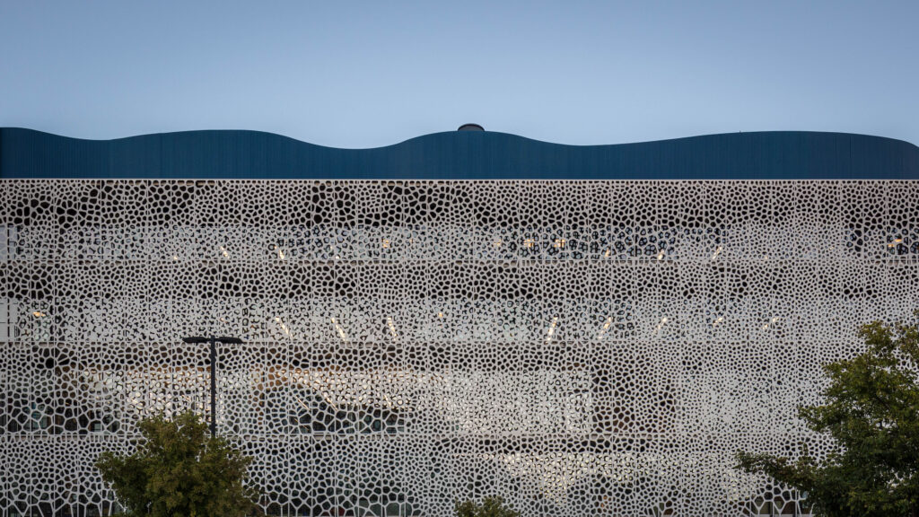 Laser-cut Sunshades Encase Office Building - Metal Architecture